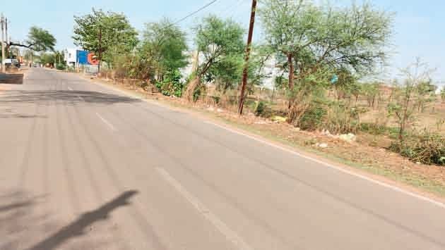 The unpaved canal on Saroda Dam Road is in a bad state, filled with ...