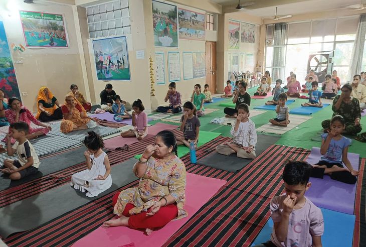 Training yoga teachers, vowing to spread the benefits of yoga to the masses