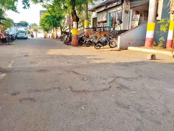 Two-wheeler riders are facing problems due to potholes on the road near ...