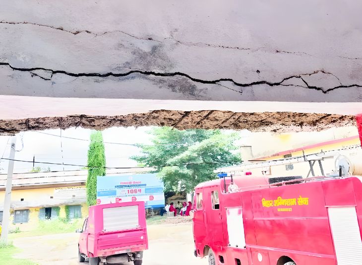 The fire department building has its workers sitting under a ...