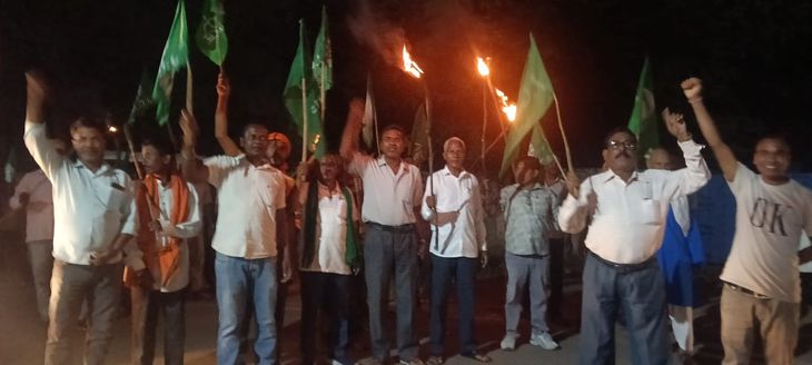 A torchlight procession was taken out to protest against the ...