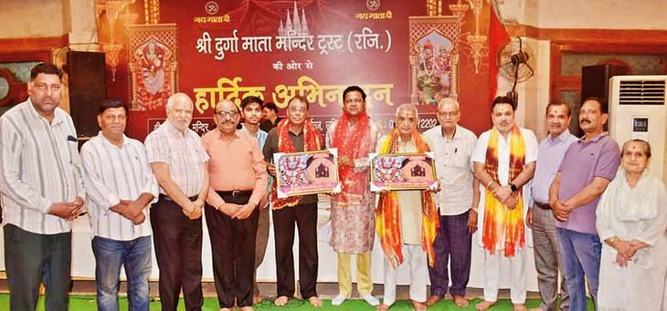 Mother's robe is red in color... devotees danced in the nectar shower ...