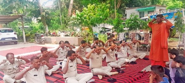 Policemen learning yoga to stay stress-free
