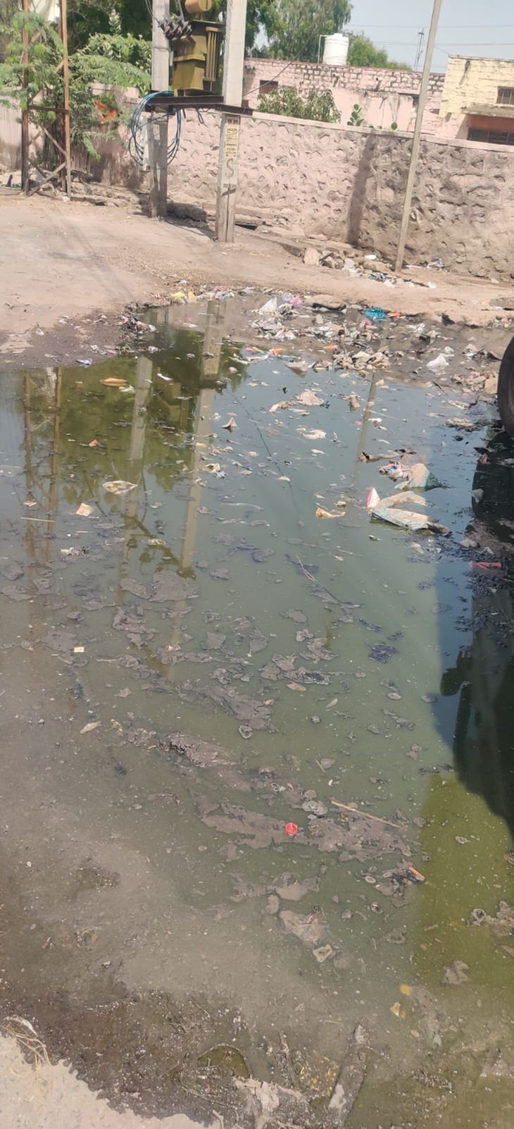 The drain in front of the city council overflows, spilling garbage and ...