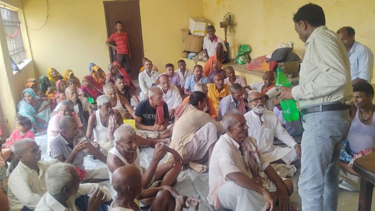 In the Chaupal, officials told the farmers how to save soil fertility.