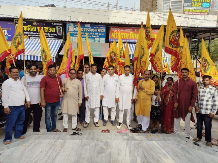 Devotees took out a flag procession dedicated to their ancestors ...
