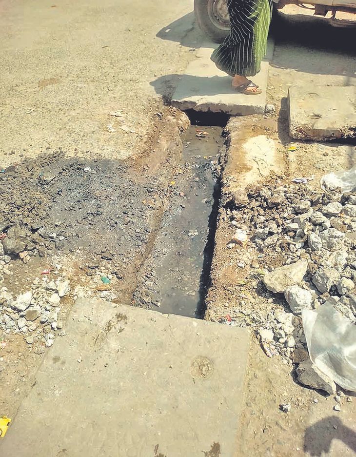 Open drain outside the vegetable market is a cause of trouble