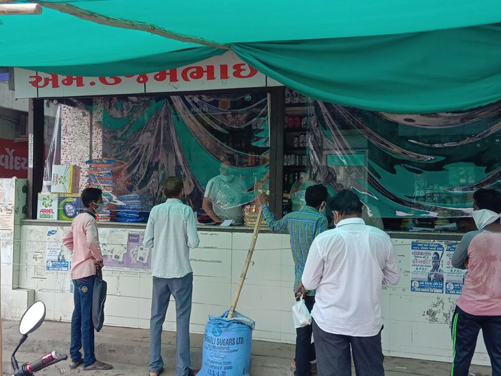 Plastic curtains outside shops to prevent core transition in Patan
