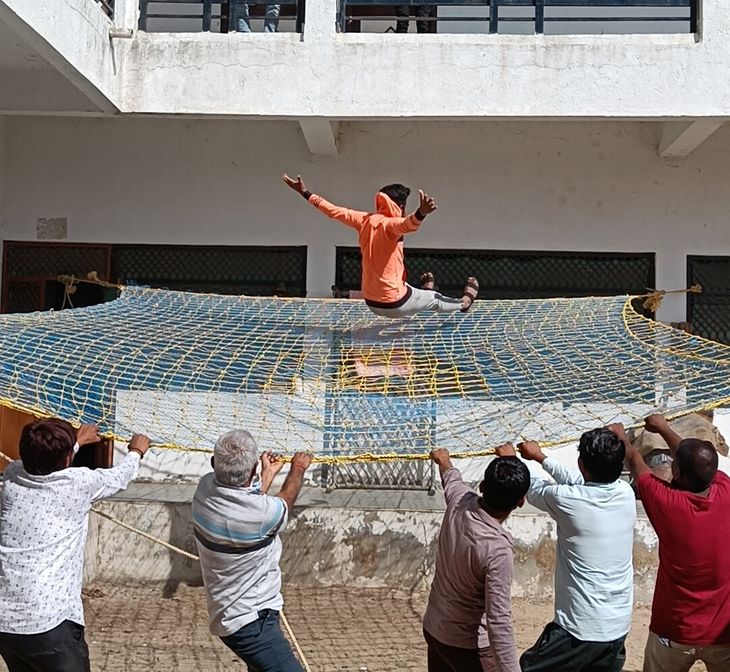 People trapped in a multi-storey building were trained on how to jump ...