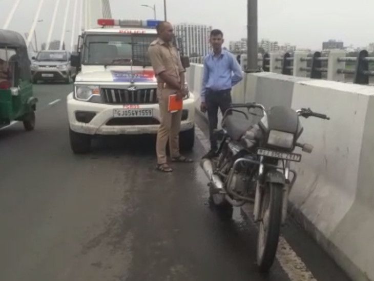 After putting his bike on the cable stayed bridge in Surat, the youth ...