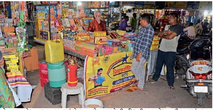 A firecracker stall equipped with fire safety equipment in the mandap ...