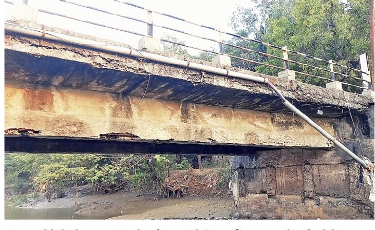 The rods of the Auranga Bridge connecting the villages of the Valsad ...