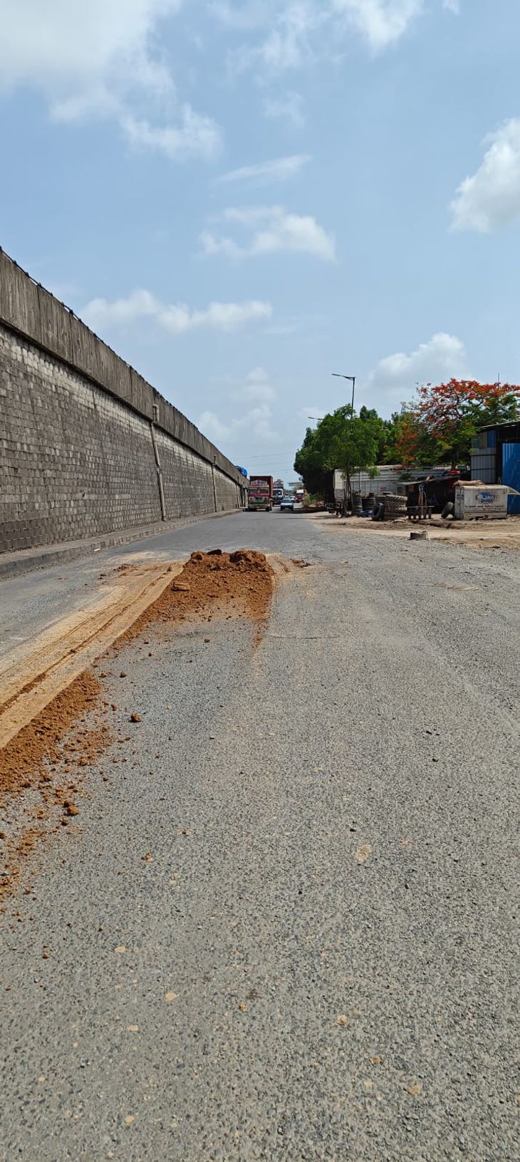 Difficulty with mud falling out from trucks passing by washed-up bridge ...