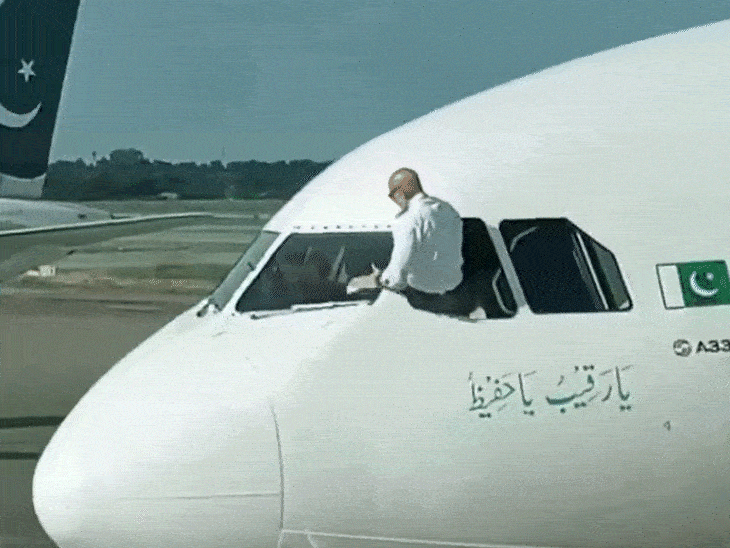 Only a Pakistani can do this! Pilot hangs from cockpit of plane and ...
