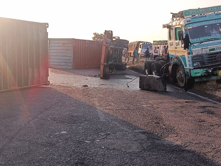 Container trailer jumps divider and collides with truck on National ...