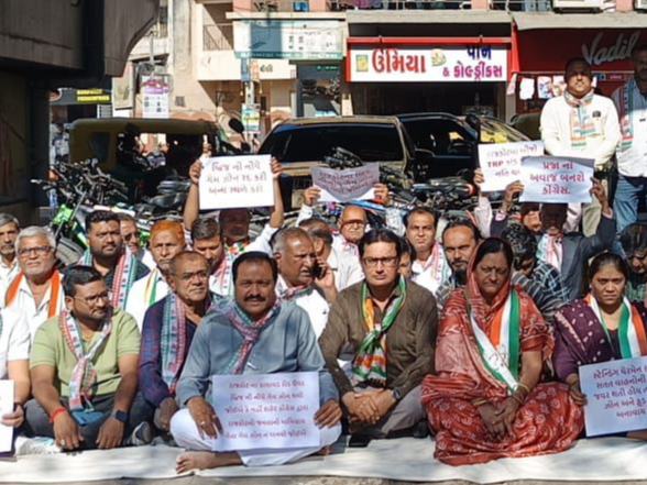 Protest with Congress placards on Kalavad Road over game zone issue ...