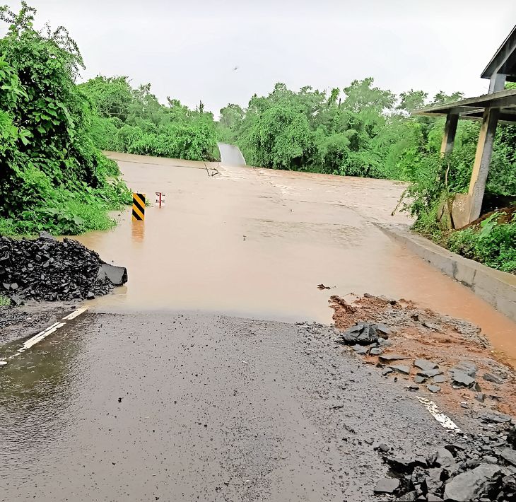 Water overflowed on the low-level causeway leading from Palgabhan to ...