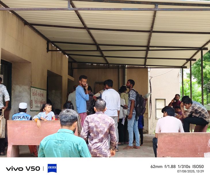 Applicants gathered under the leafy shed outside the ATVT branch in the ...