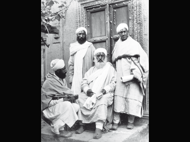 Why do Kashmiri Pandits keep the name of their village in their surname?