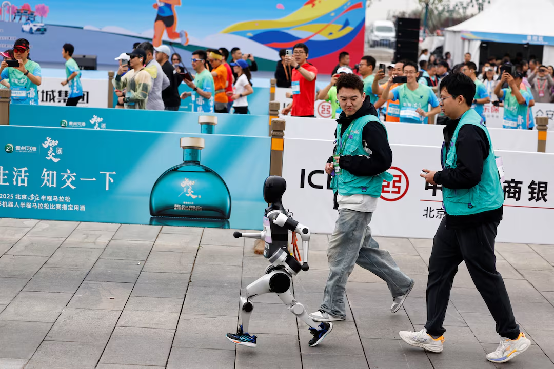 When robot runners join humans in historic Beijing half-marathon ...