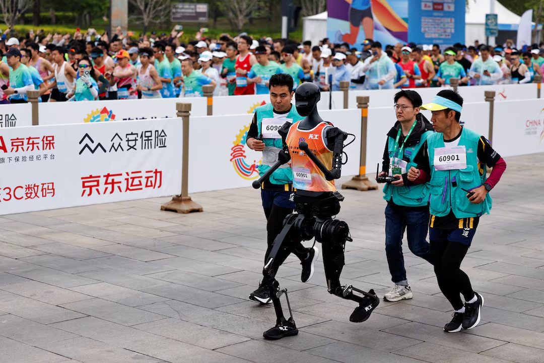 When robot runners join humans in historic Beijing half-marathon ...