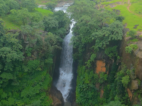 Drone view of Dahel waterfall plunging 300 feet,300-foot waterfall with ...
