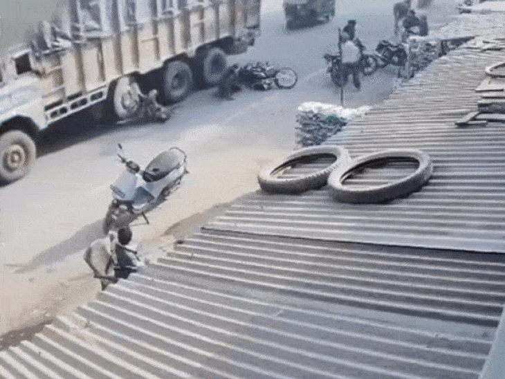 Truck runs over woman who fell from bike Wife dies on the spot husband narrowly escapes after ...