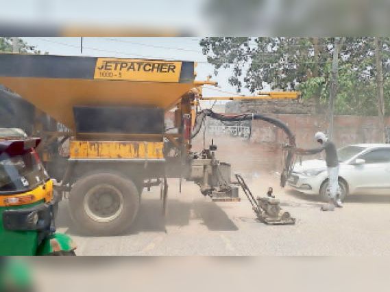 Patchwork of pit on the roads started with jet patcher machine, will ...