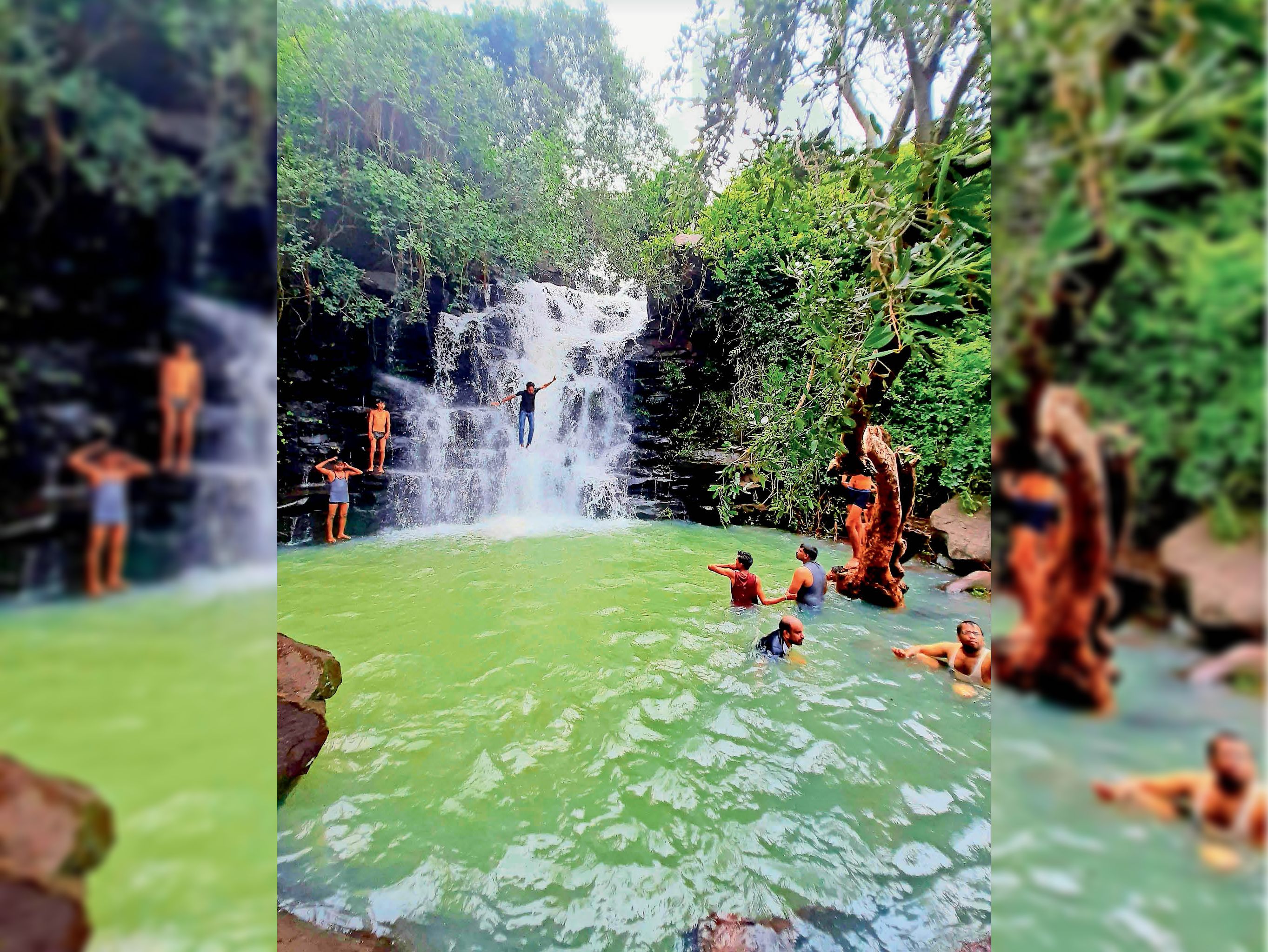 Mini Pachmarhi waterfalls falling from the height amidst the greenery ...