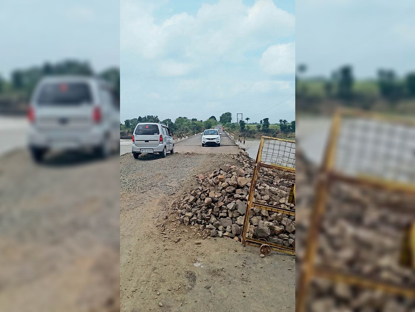 Traffic started by putting boulder and soil on damaged bridge of ...