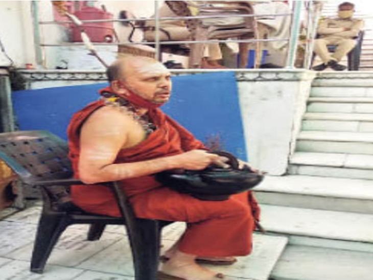 Dandi Swami stopped at the entrance of the temple with a kamandala in ...