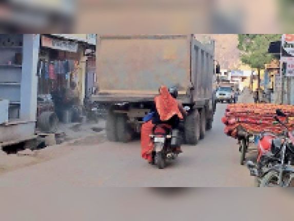 Preparing to convert the nearly 20-foot-wide Sheopur Road into a year ...