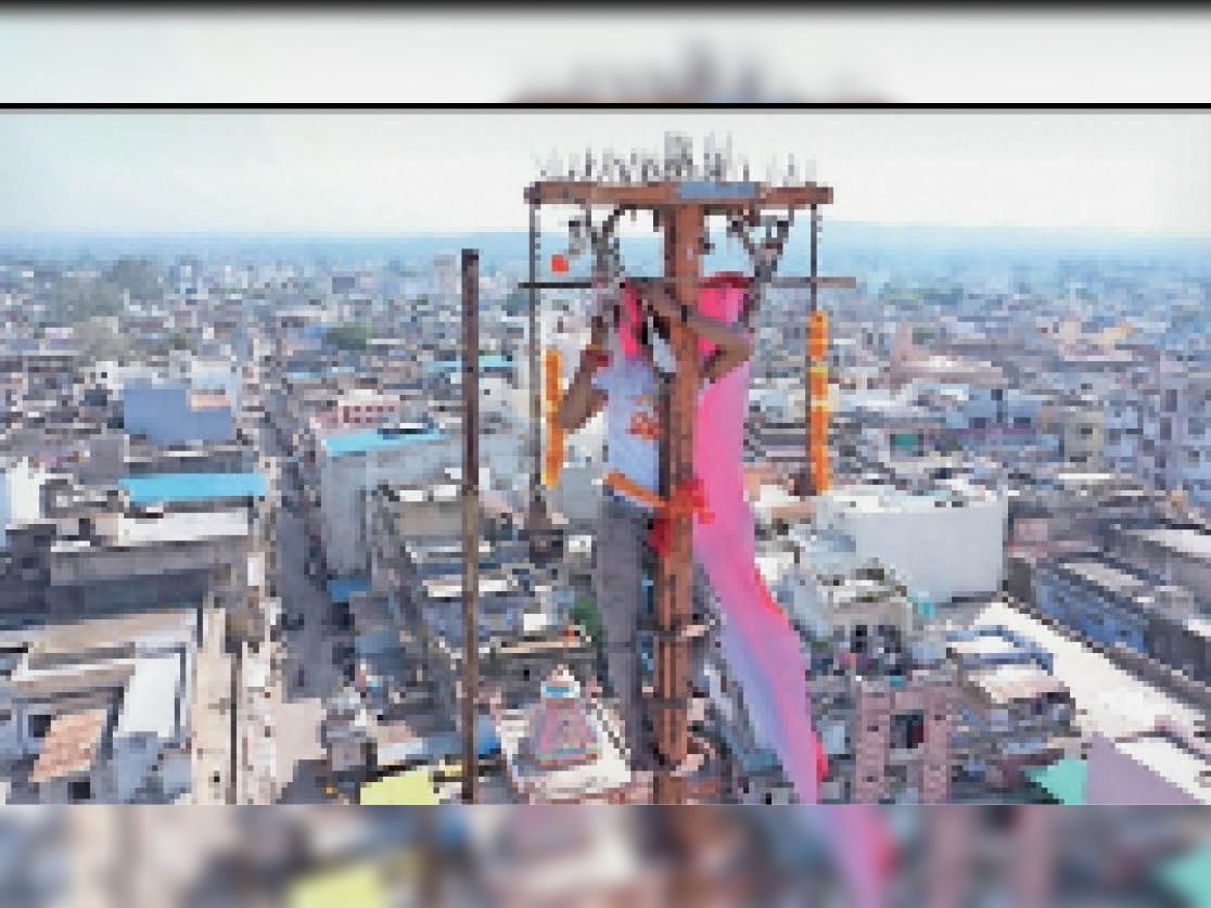 hoisted the flag on the 97 feet high peak of Jhalrapatan Sun Temple ...