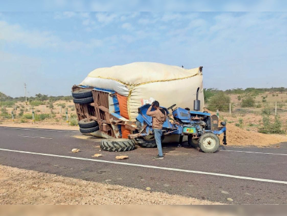 Overloaded tractor tire burst full of fodder, trolley overturned on ...