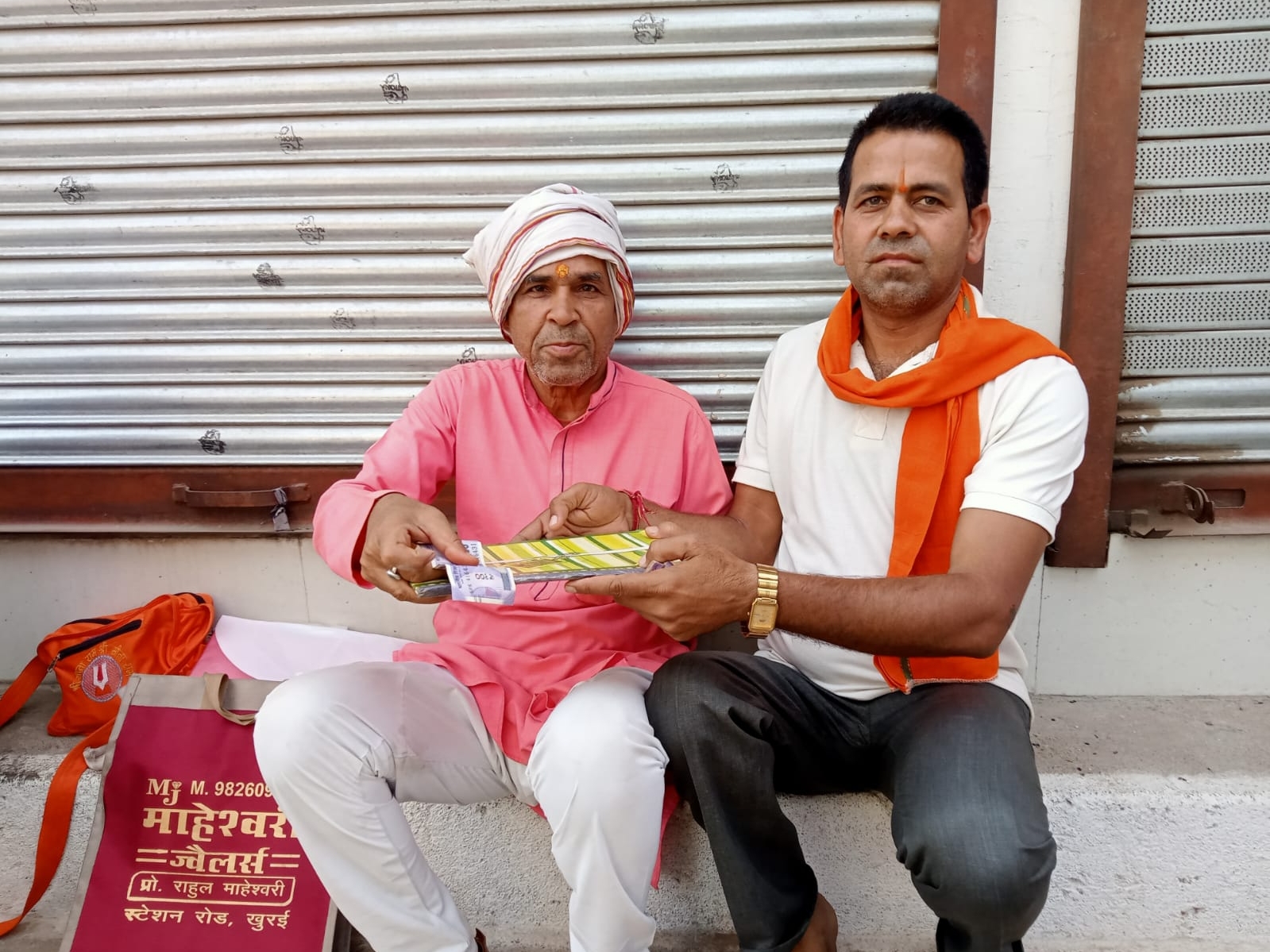 In Khurai, the members of the committee are inviting people by giving ...