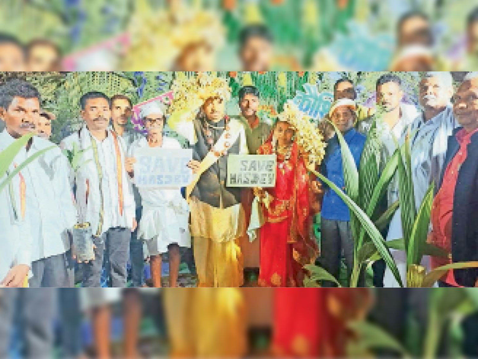 In the wedding pavilion, the bride and groom sit with the poster of ...