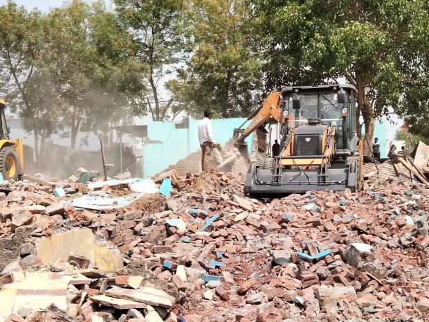 The corporation removed the houses which were obstructing the road ...