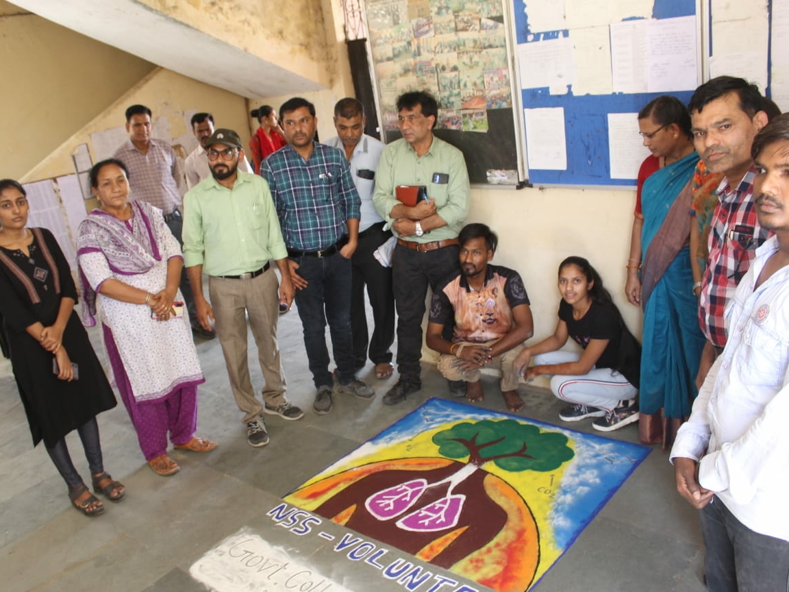 Message of environmental consciousness given by poster and rangoli ...