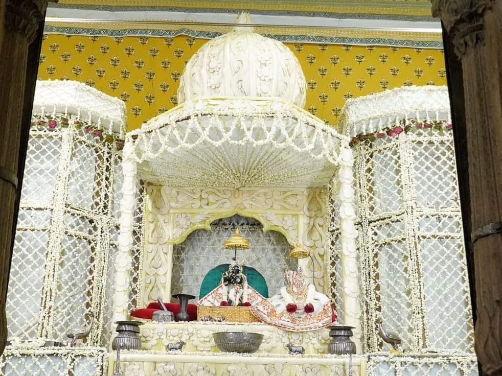 Radharaman Lal, seated in the tableau of Radhakund Shyamkund made of ...