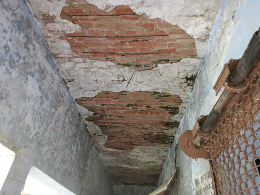 Completely dilapidated building built 35 years ago; Branch running in ...