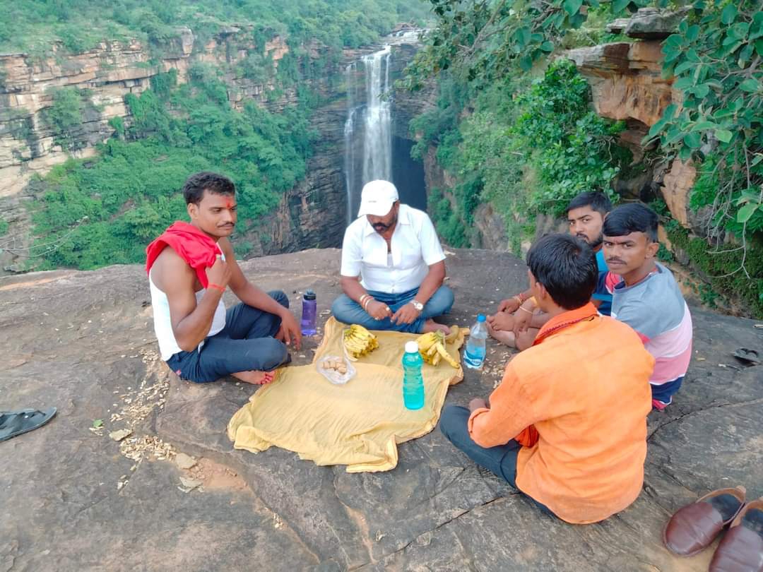 People coming to Telhar Kund Falls of Kaimur, water falls from a height ...