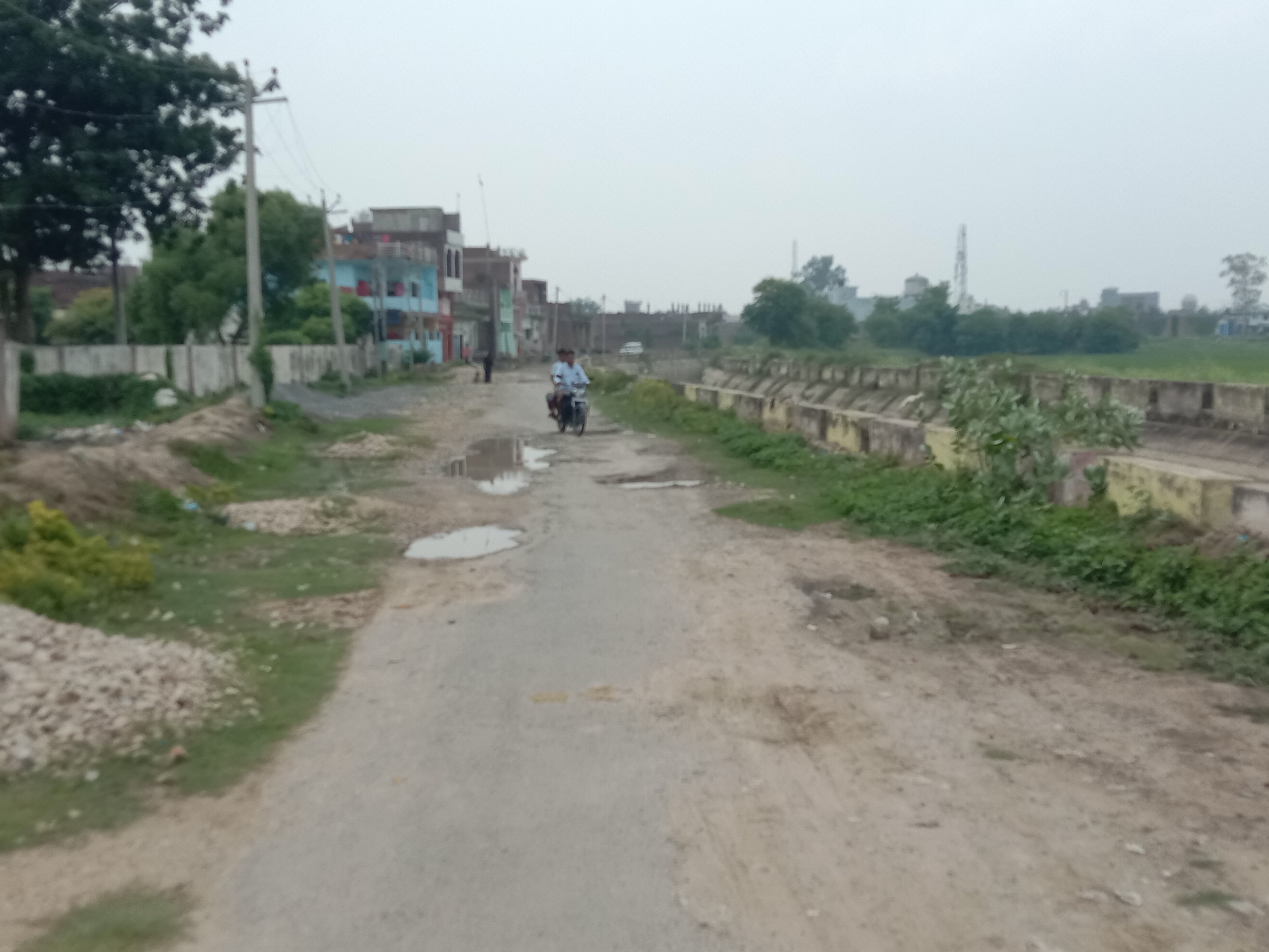 Potholes everywhere on the road connecting dozens of villages; water ...