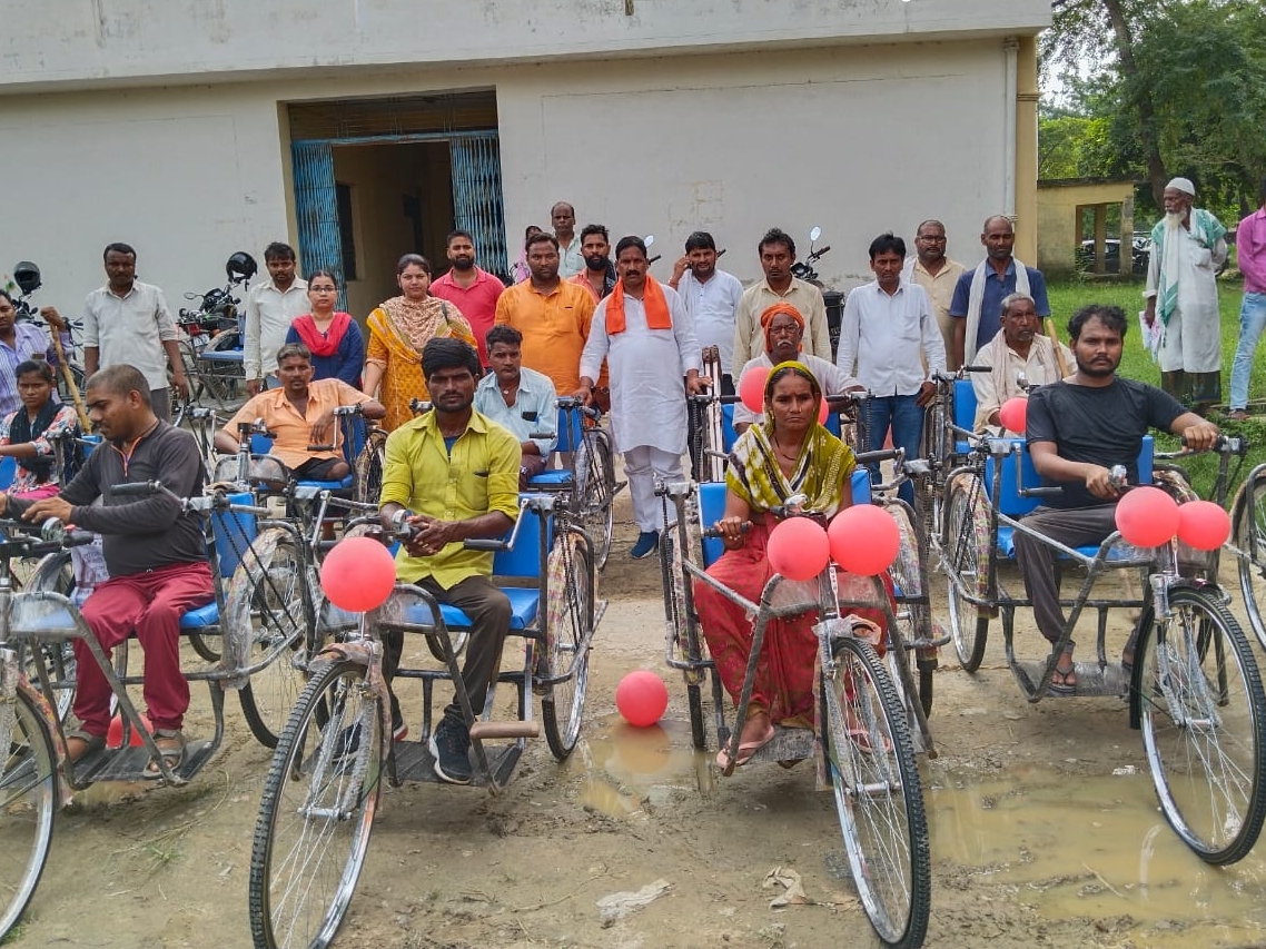 BJP district minister distributed wheel chair, tricycle and earring ...