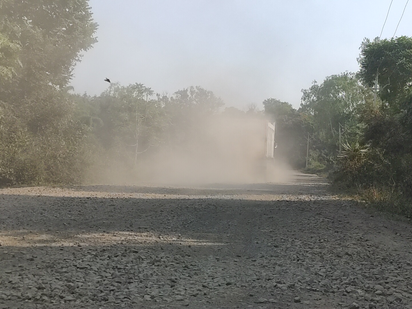 It was difficult to walk with potholes and dust on the 8 KM long bypass ...