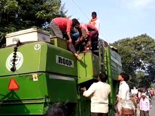 Combine machine hit by high voltage wire, driver injured