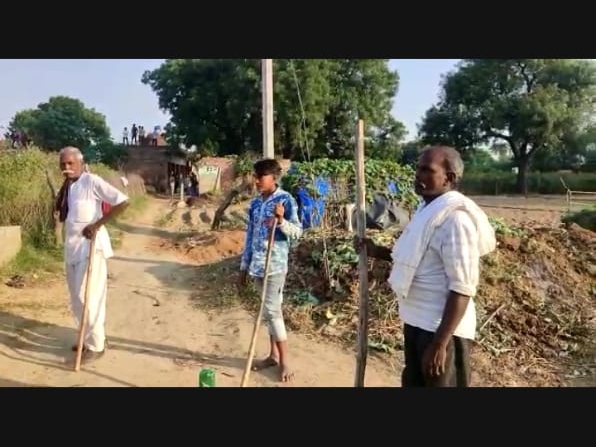 Villagers running with sticks, people guarding outside the village ...