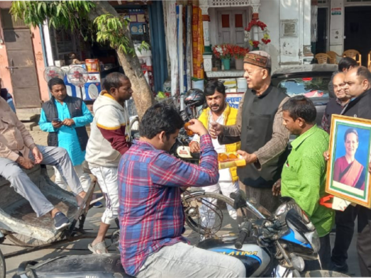 Party leaders expressed their happiness by feeding sweets to passers ...