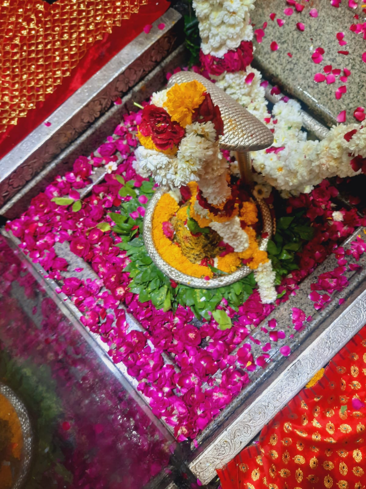 Lord Omkar and the court decorated with flowers in Mangala Aarti, see ...