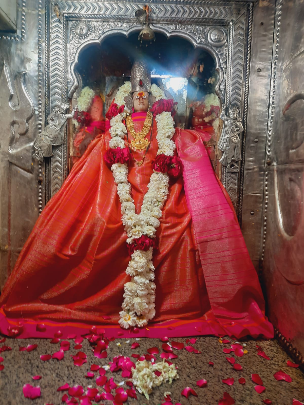 Lord Omkar and the court decorated with flowers in Mangala Aarti, see ...