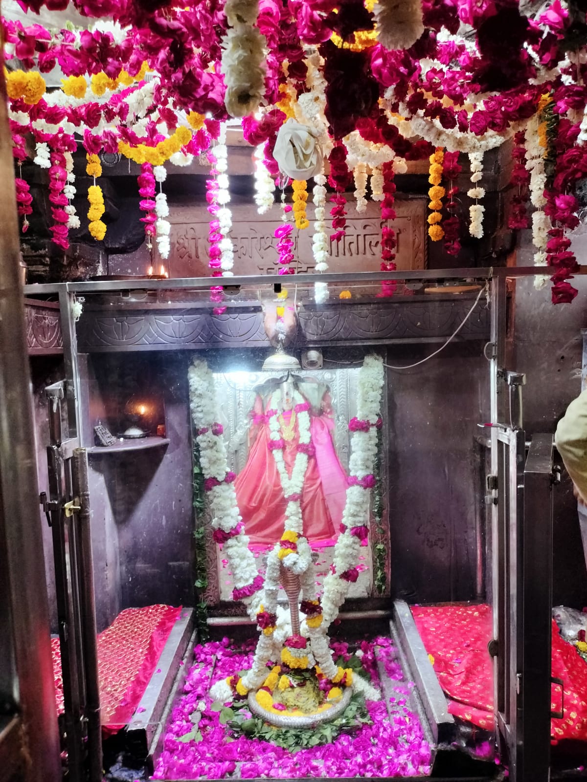 Lord Omkar and the court decorated with flowers in Mangala Aarti, see ...